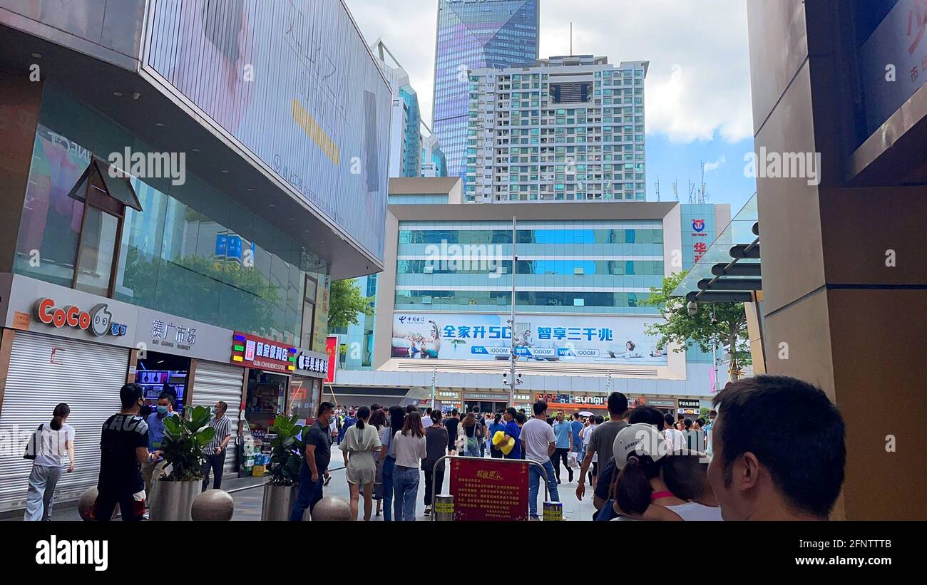 SHENZHEN, CHINA - MAY 18, 2021 - People walk out of SEG Plaza in Shenzhen, south China's ...
