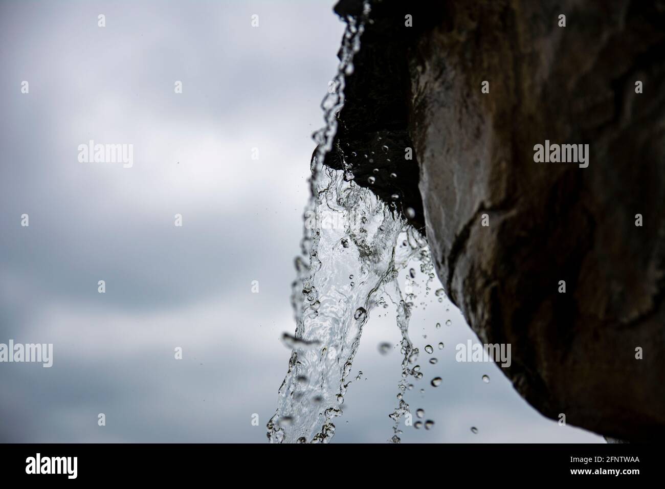 waterfall against the sky. the falling water is frozen in the picture ...