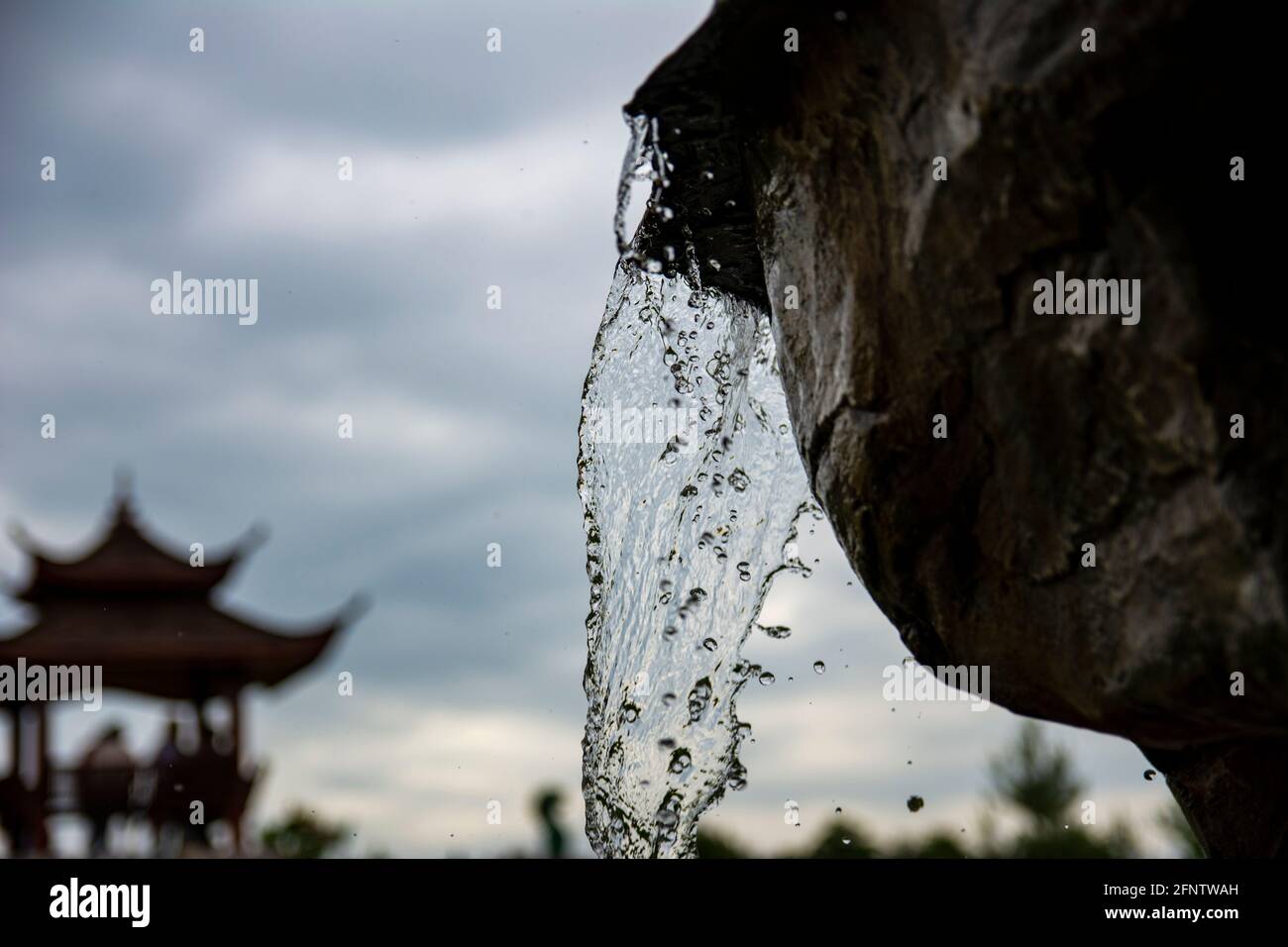 waterfall against the sky. the falling water is frozen in the picture ...
