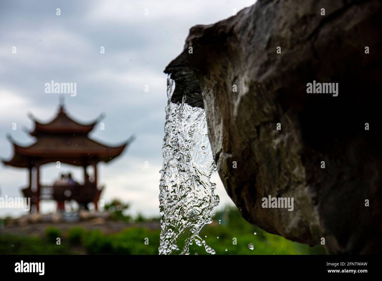 waterfall against the sky. the falling water is frozen in the picture ...