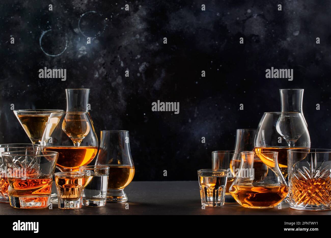 Hard strong alcoholic drinks, spirits and distillates in glasses in ...