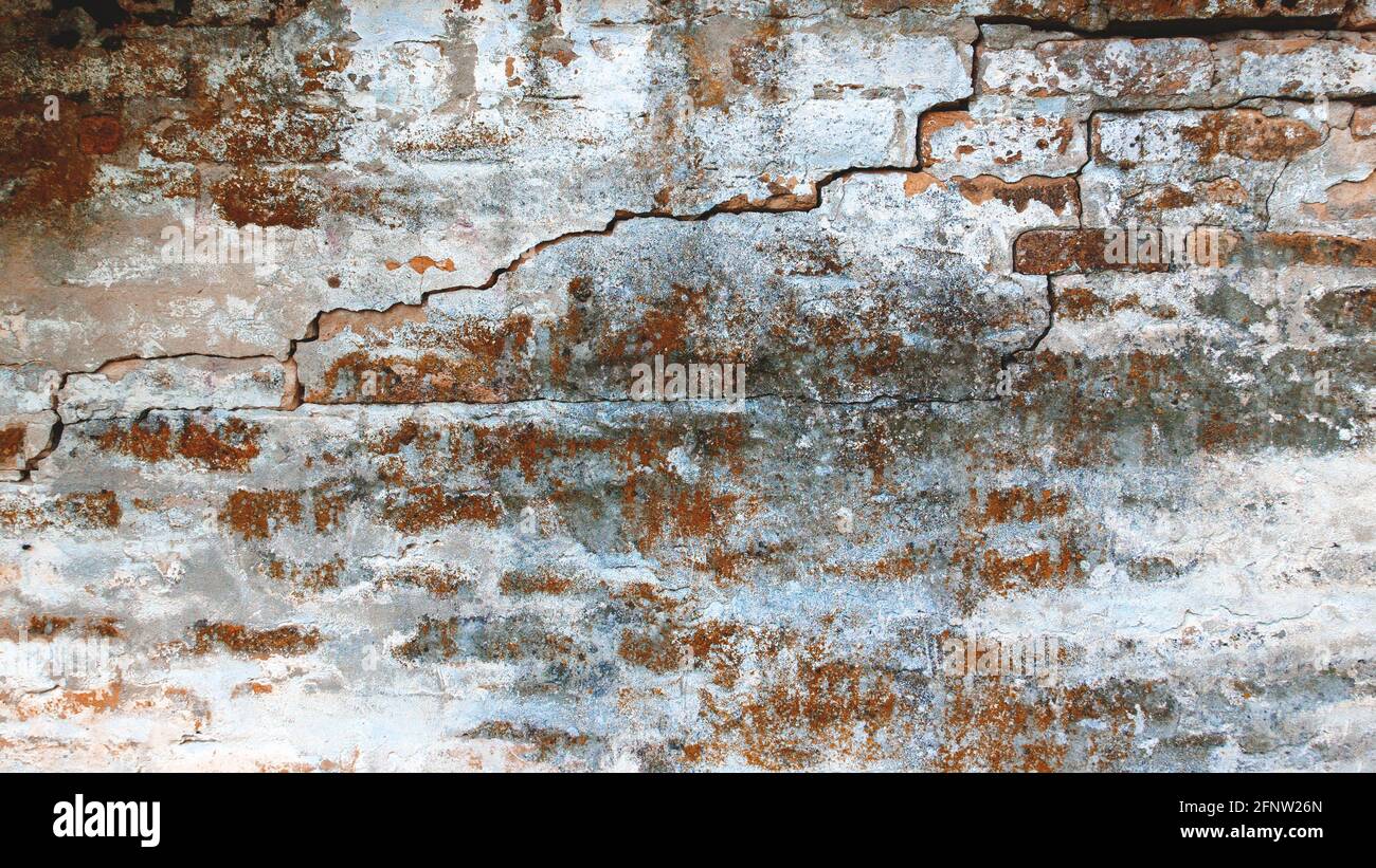 Old cracked brick wall surface texture as background Stock Photo - Alamy