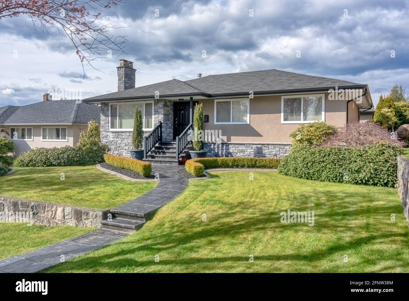 Family residential house on sunny day on cloudy sky background Stock ...