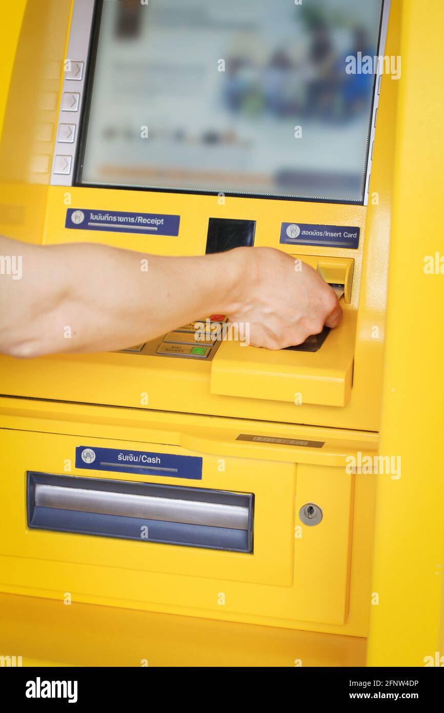 Man pressing password number on ATM machine Stock Photo - Alamy