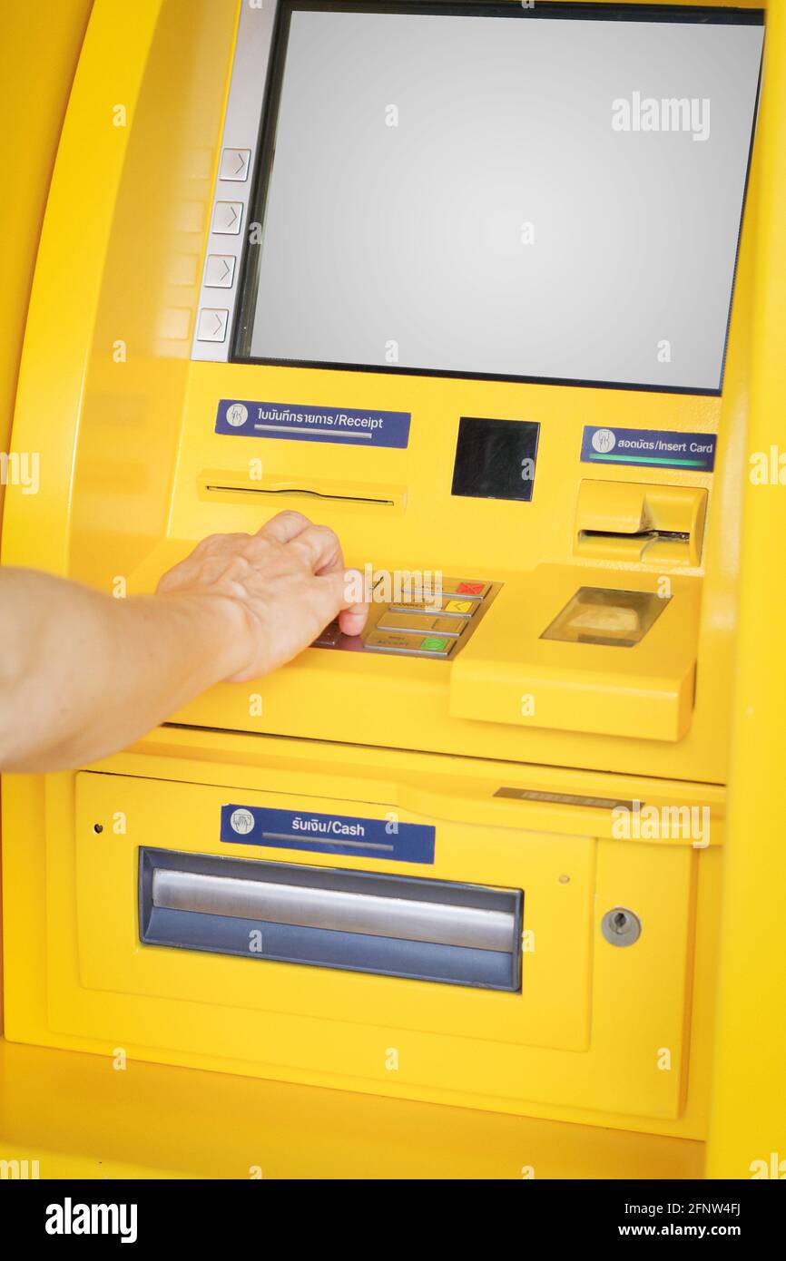 Man pressing password number on ATM machine Stock Photo - Alamy