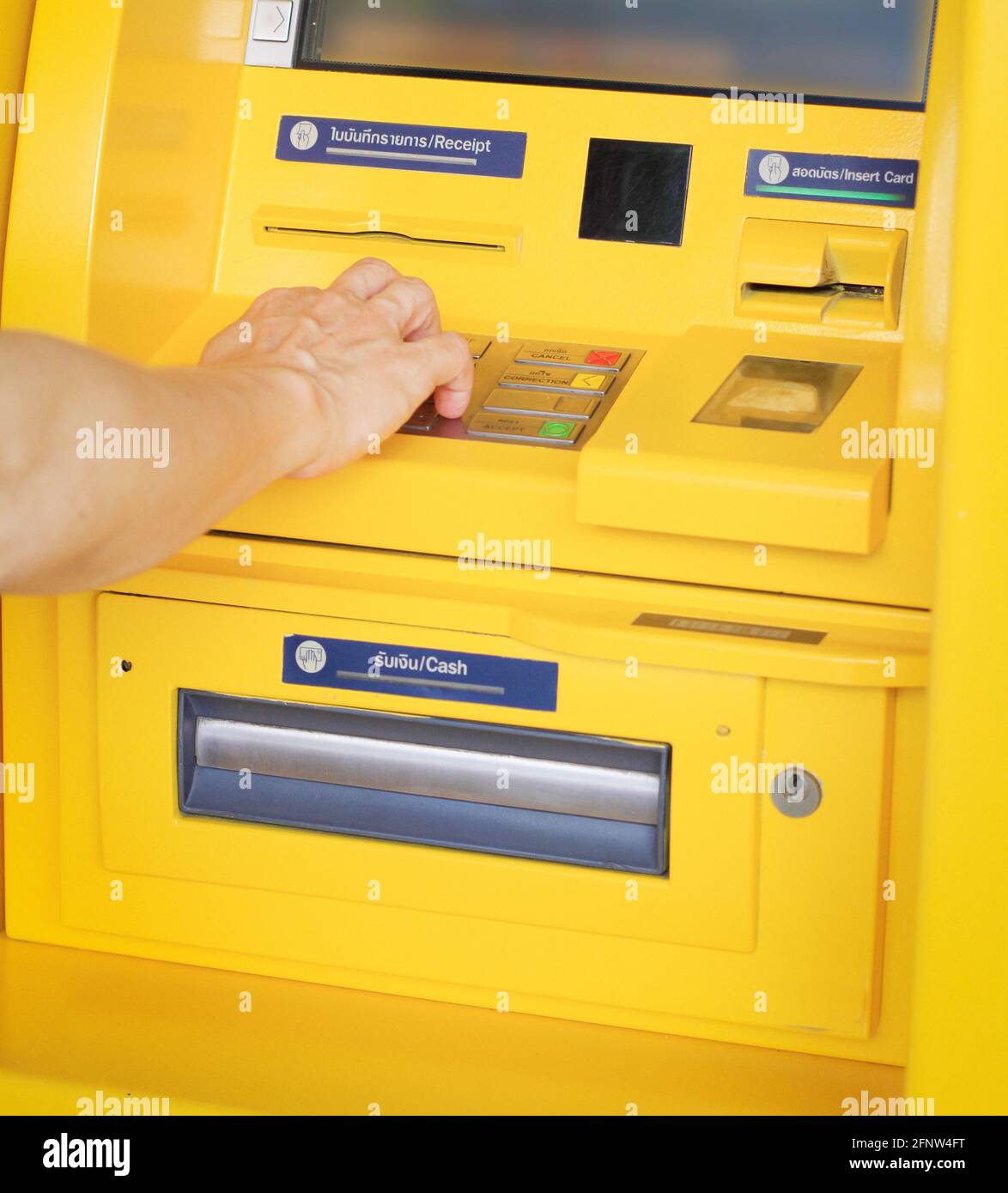 Man pressing password number on ATM machine Stock Photo - Alamy