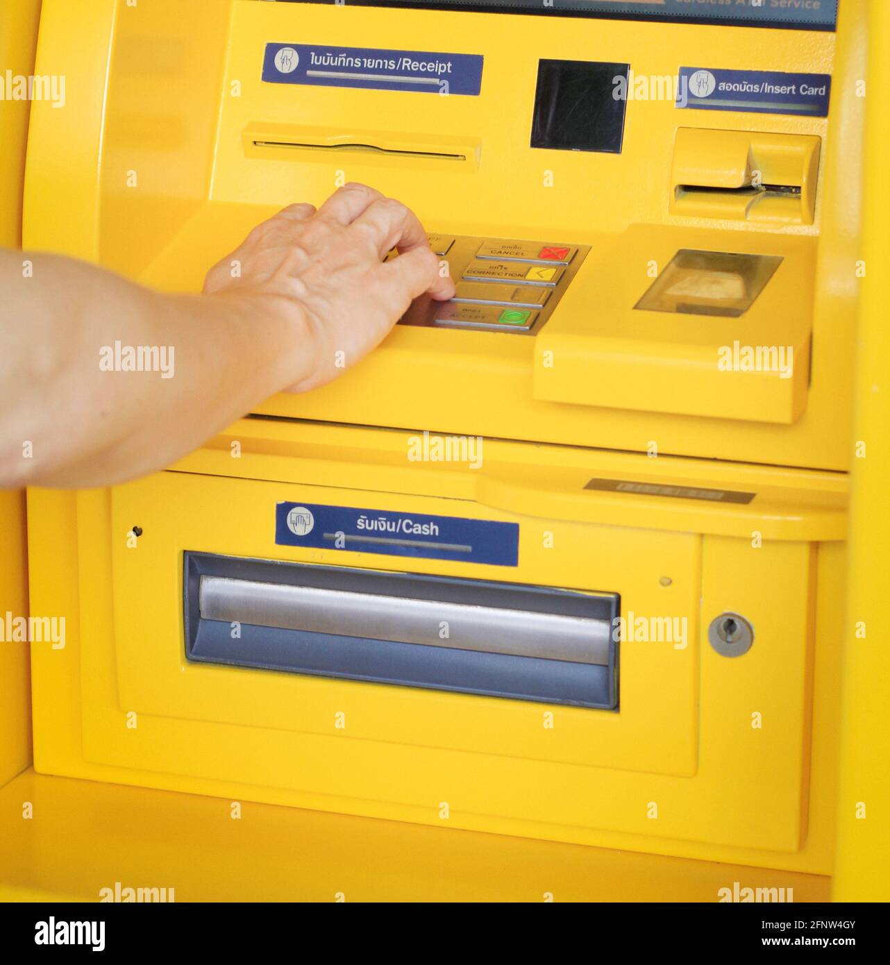 Man pressing password number on ATM machine Stock Photo - Alamy