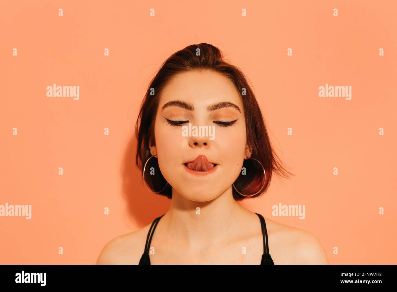 Grimacing grimace face tongue woman hi-res stock photography and images ...