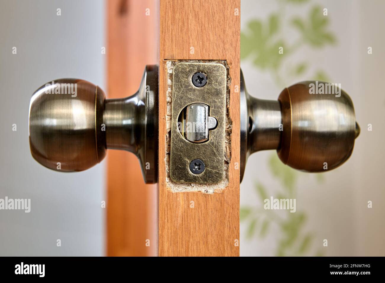 DIY installing of door knob with latch and lock in new chipboard sheet ...
