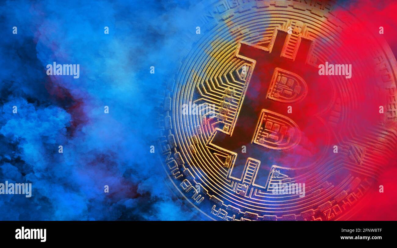 golden bitcoin coin is in red and blue smoke background. cryptocurrency ...