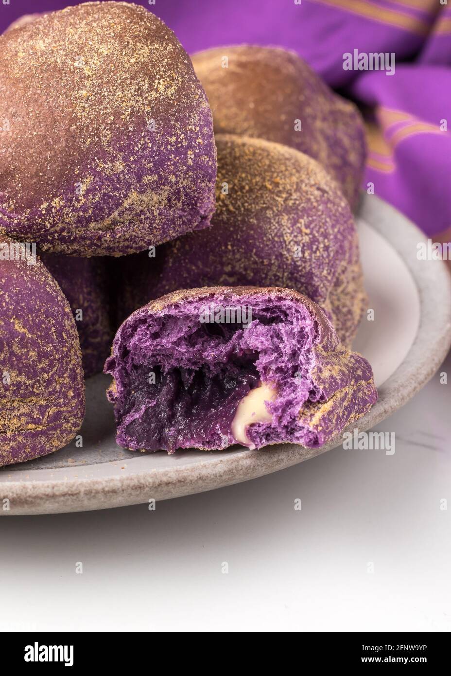 Purple yam ube bread pandesal with cheese filling Stock Photo - Alamy