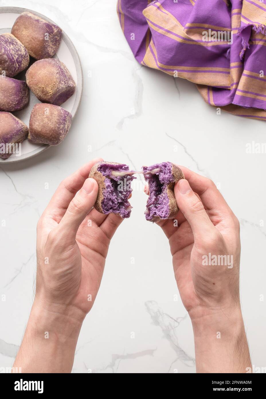 Purple yam ube bread pandesal with cheese filling Stock Photo - Alamy