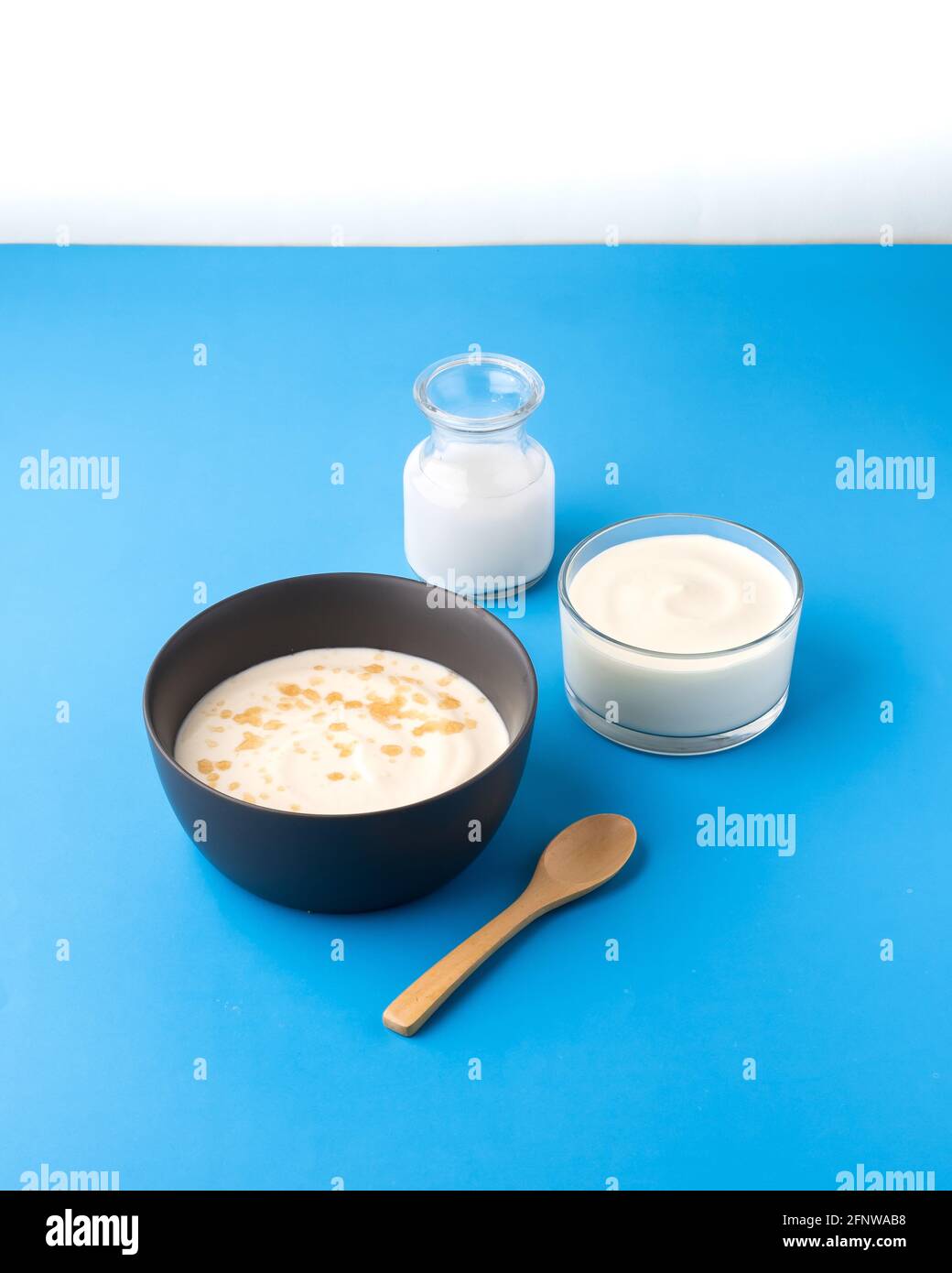 Brown sugar yoghurt on blue background Stock Photo - Alamy