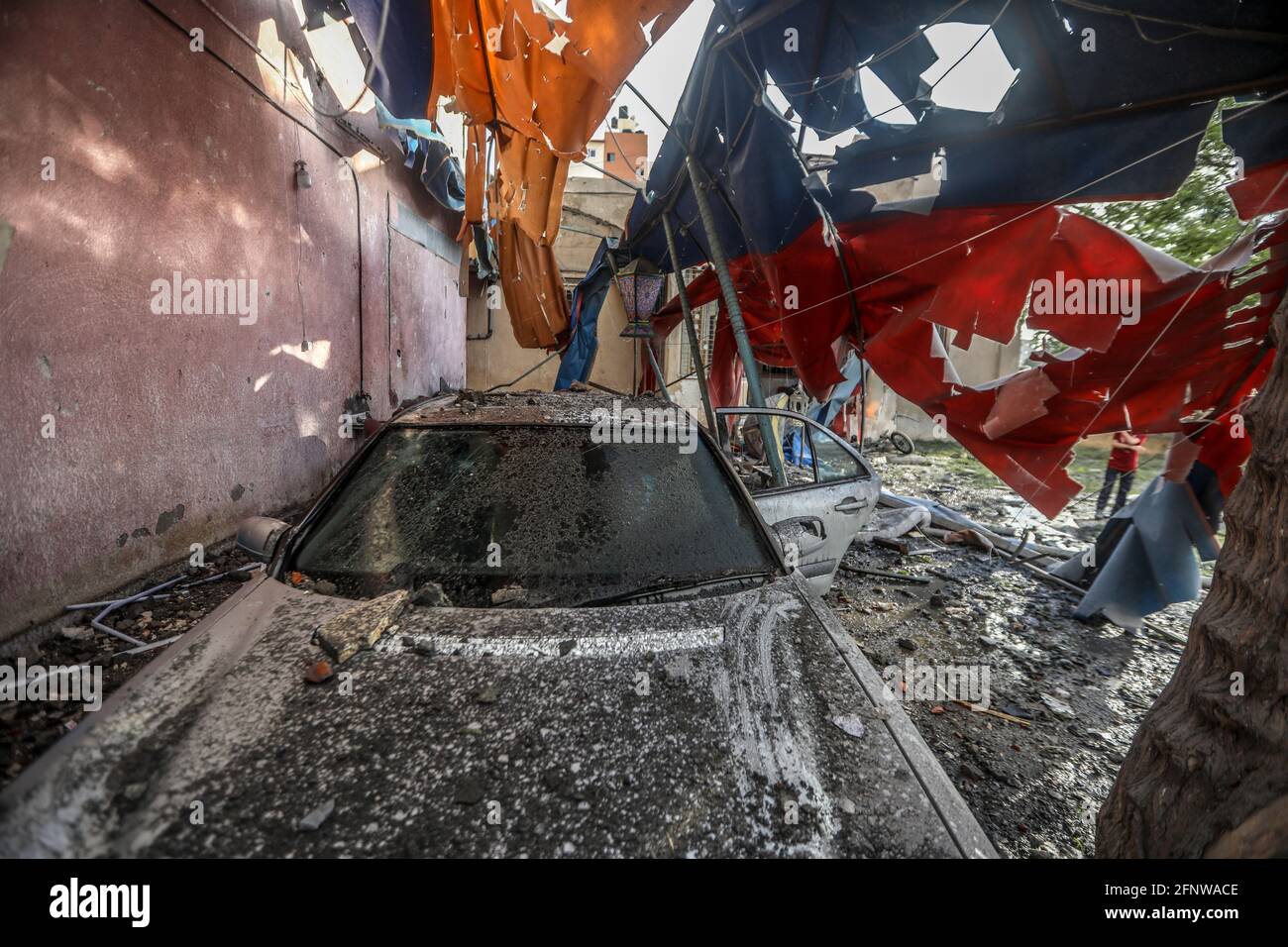 Damaged vehicles at the Palestinian Ministry of Health building and Al ...