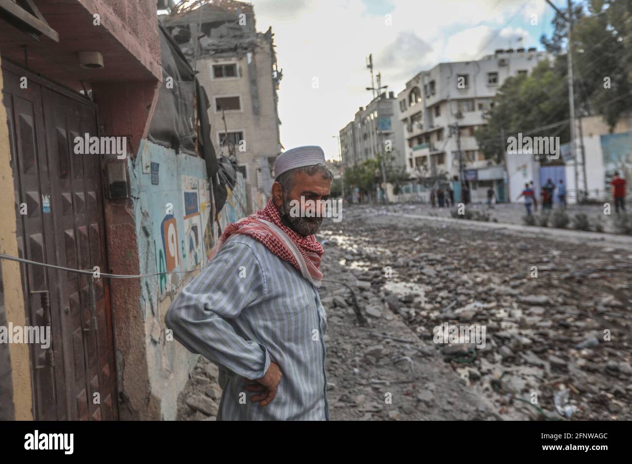 A man looks on sadly at the the damage to the Palestinian Ministry of ...