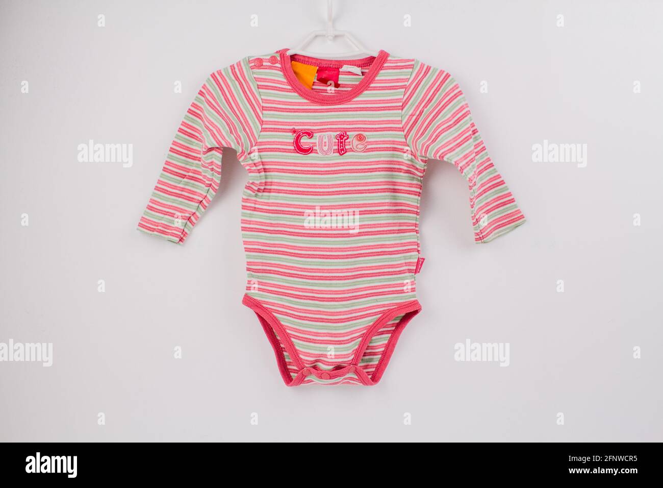 pink body for small child on a white background Stock Photo - Alamy
