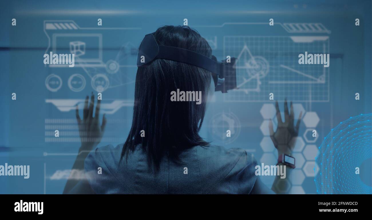 Composition of businesswoman wearing vr headset touching interactive ...