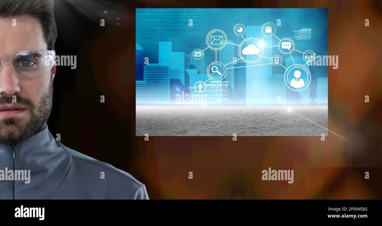 Composition of man with digital icons on screen Stock Photo - Alamy