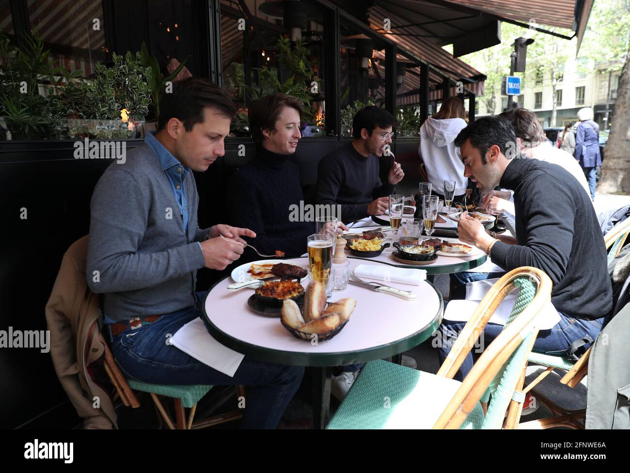 Paris, France. 19th May, 2021. People enjoy their lunch at the terrace ...