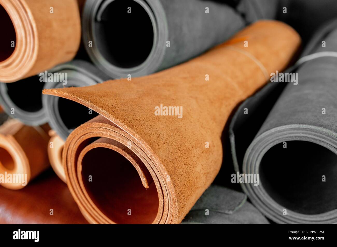 Full frame of brown and black textile genuine leather rolls Stock Photo ...