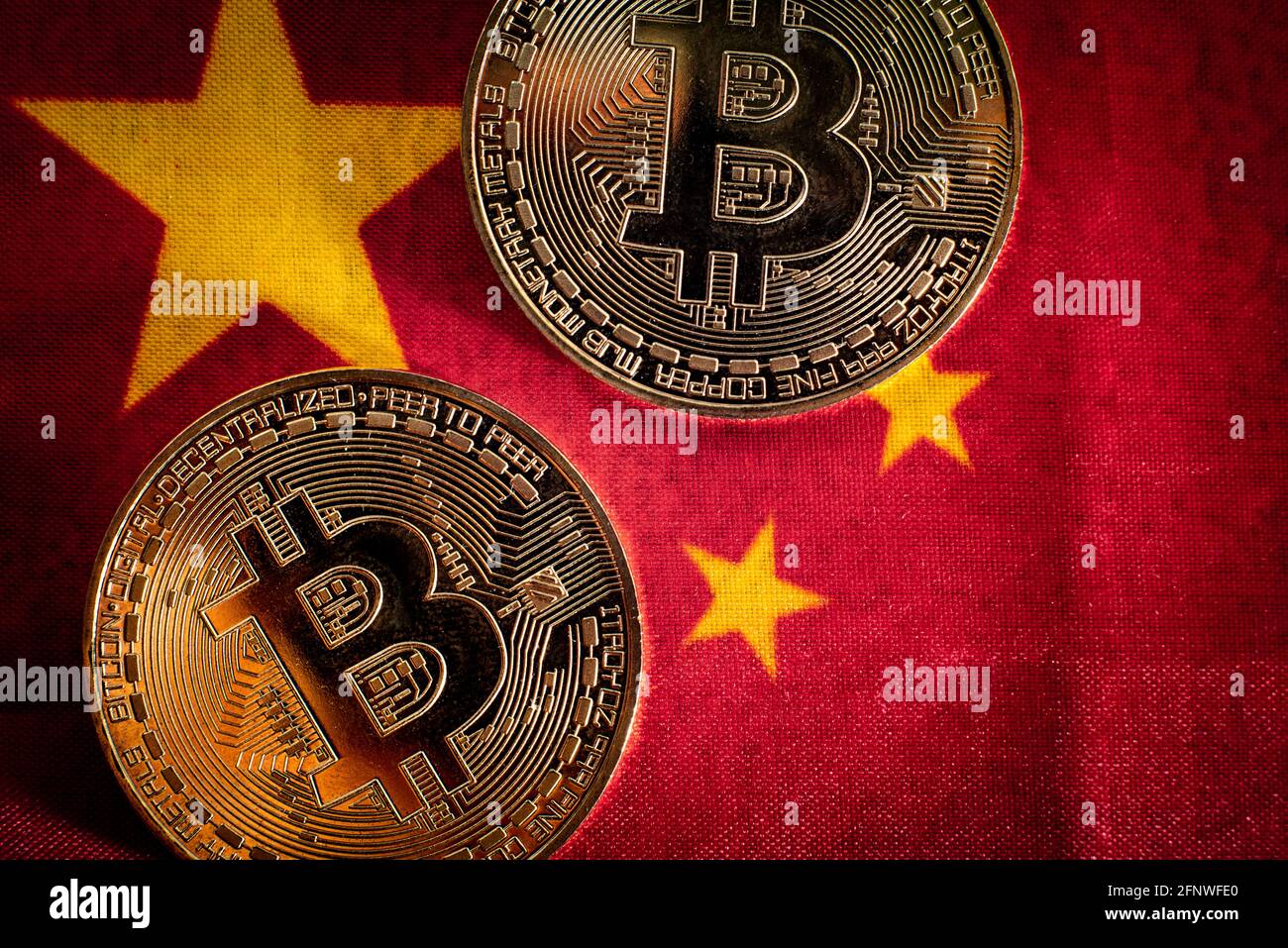 Bitcoin coins on the flag of China, country against its use, recently ...