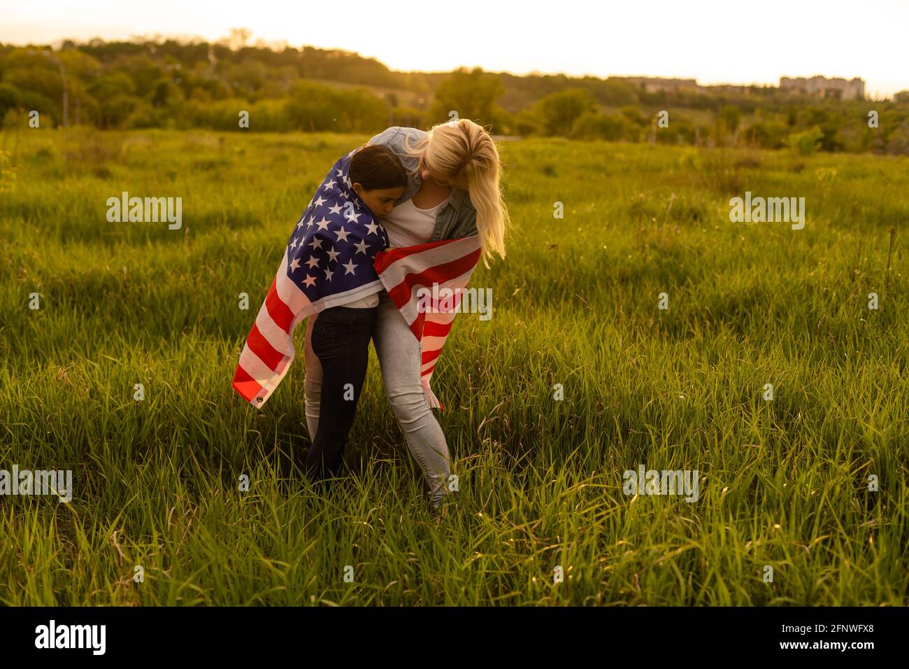 Crying little girl saying goodbye to her military mother outdoors Stock ...