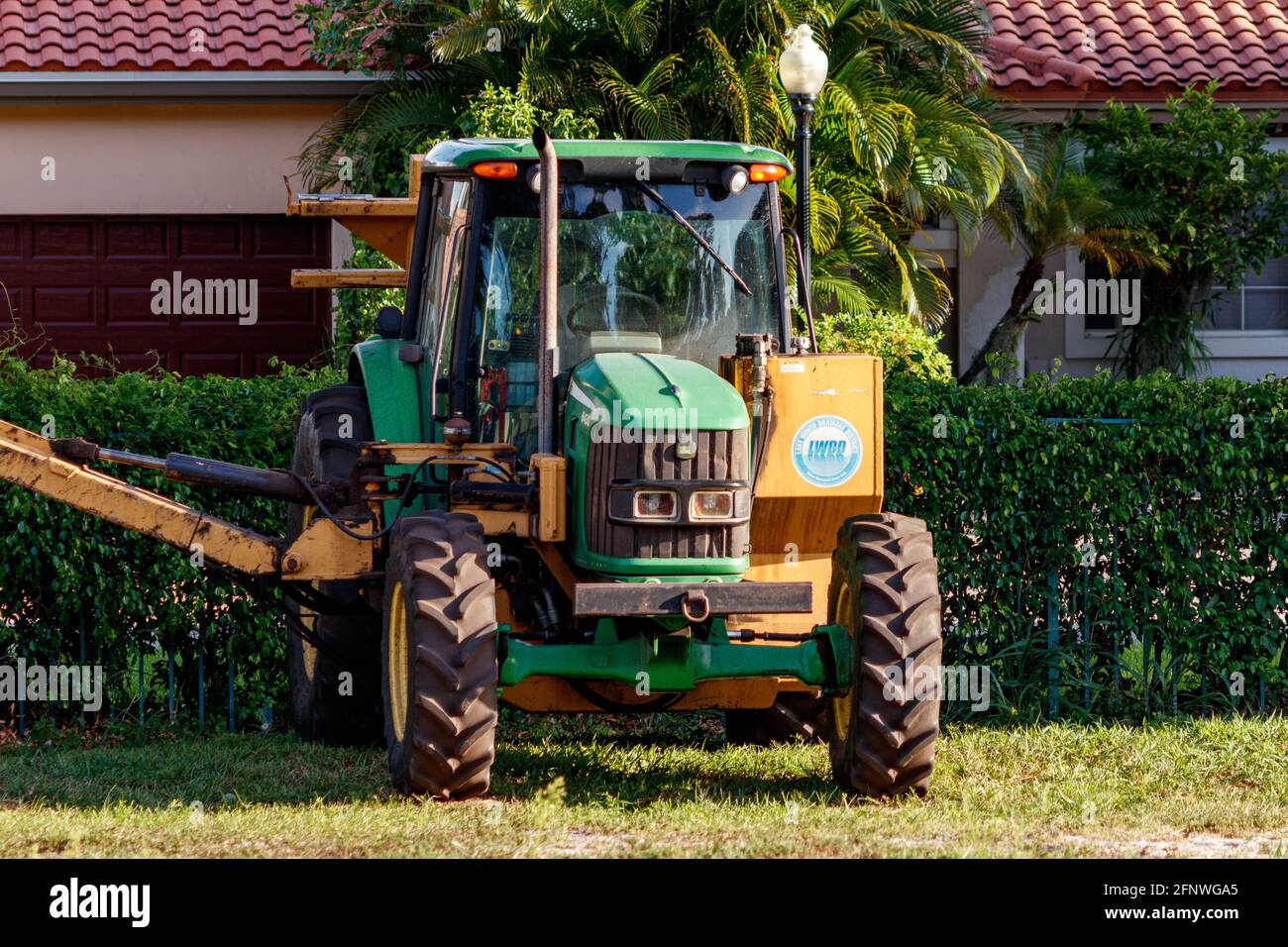 John Deere 6430 Tractor with a long boom for cutting and mowing and ... John Deere 6430 Tractor with a long boom for cutting and mowing and ...