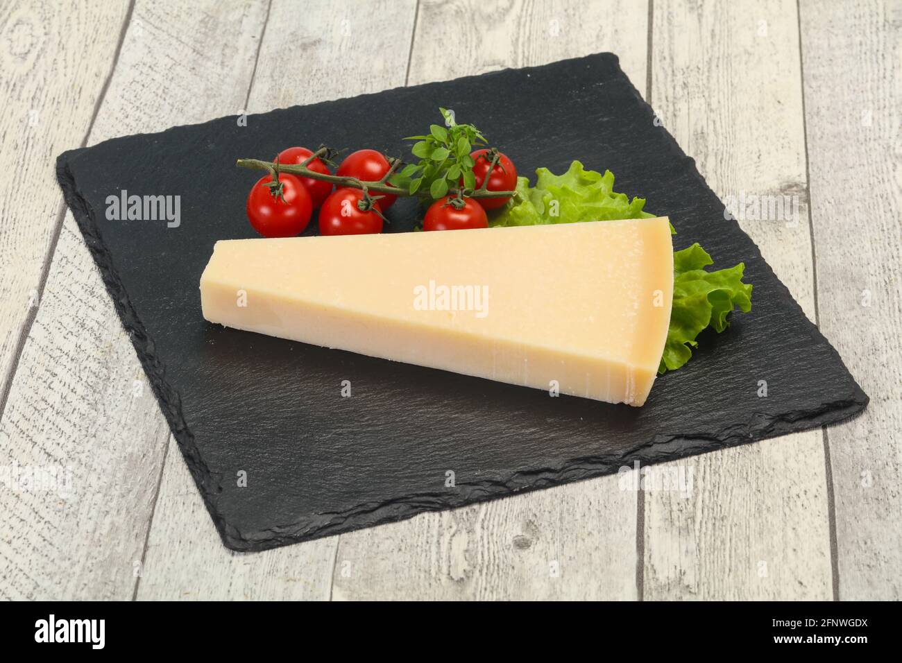 Italian traditional parmesan cheese triangle served salad Stock Photo ...