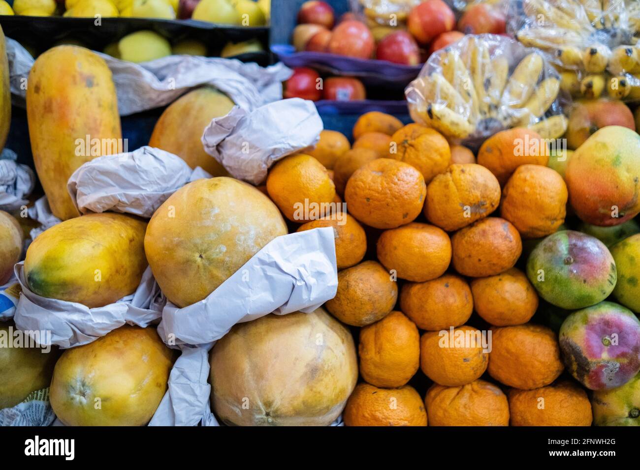 Colorful fruit stand with papayas, tangerines, bananas, and more Stock ...