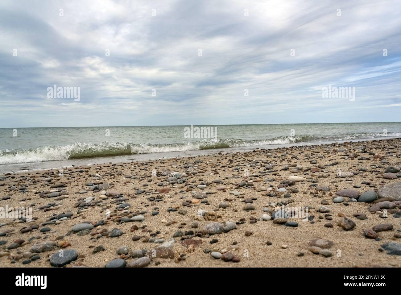 Beautiful view of stones on a sandy shore Stock Photo - Alamy