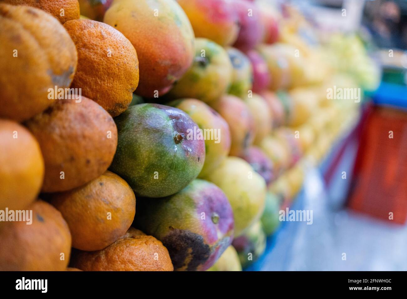 Close-up of a colorful fruit stand with tangerines and mangoes Stock ...