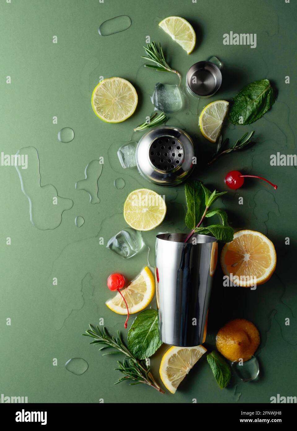 Shaker with ingredients for making cocktails. Green background. Top ...