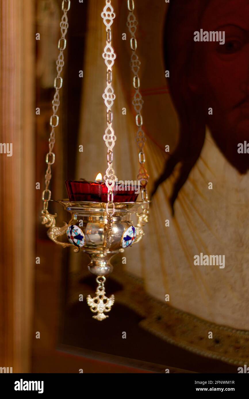 Icon lamp in front of icon in Orthodox Church. Indoors, day light Front ...