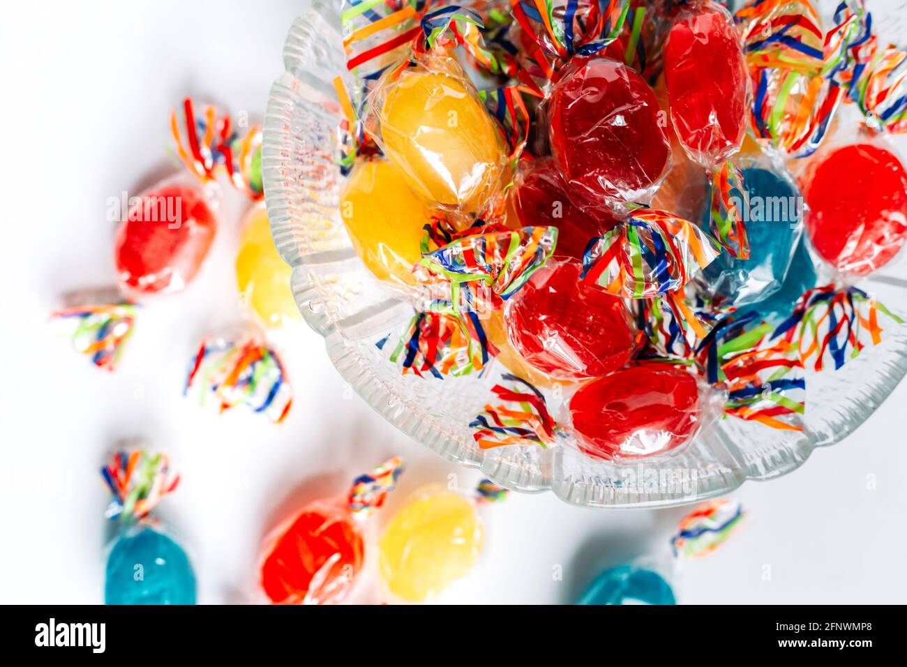 Bowl full with mix hard wrapped candies isolated on white background ...