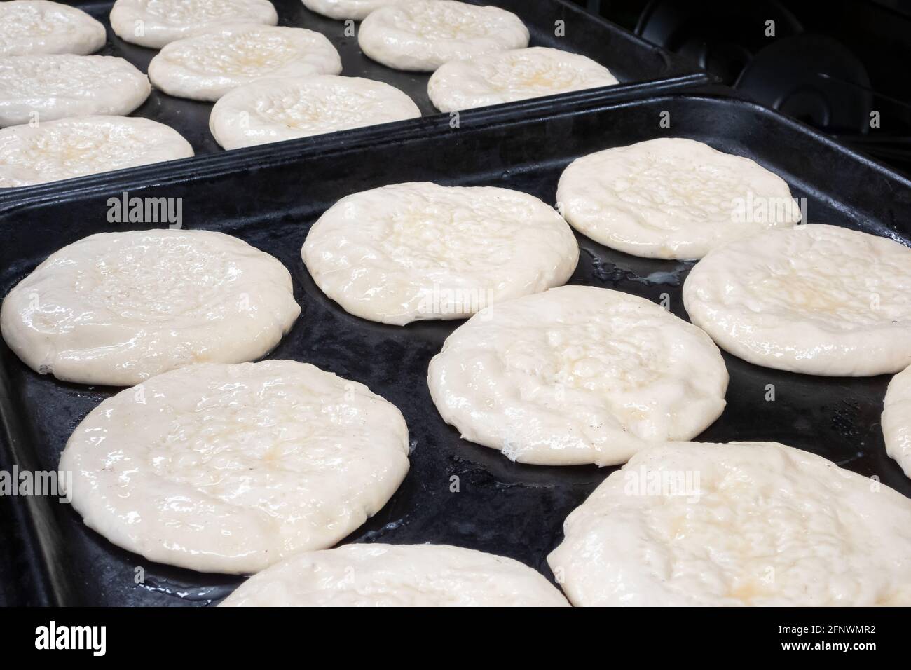 Raw cakes before baking on baking sheet Stock Photo - Alamy