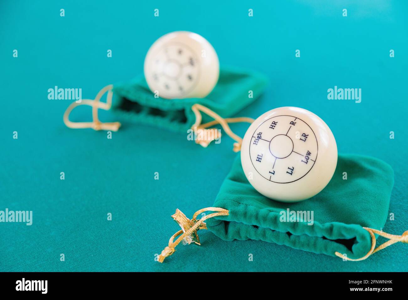 Labeled billiard balls with green packaging bags Stock Photo - Alamy