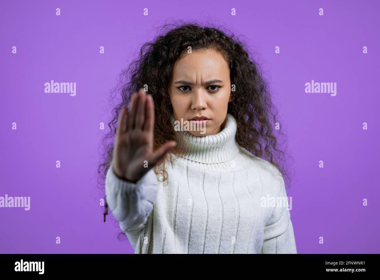 Pretty woman disapproving with NO hand sign gesture. Denying, rejecting ...