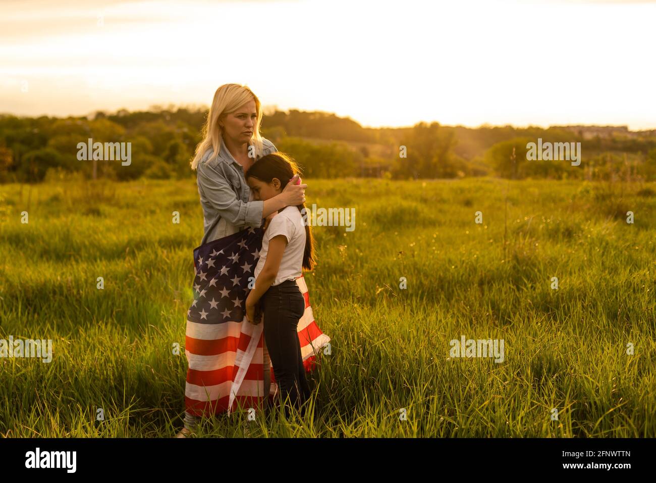 Crying little girl saying goodbye to her military mother outdoors Stock ...