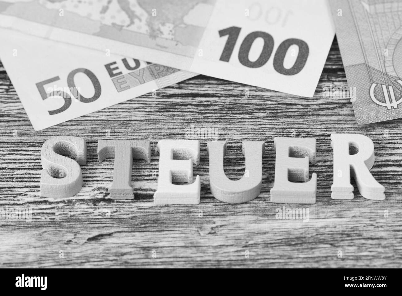 wooden letters with the German word 'Steuer' which means in English ...