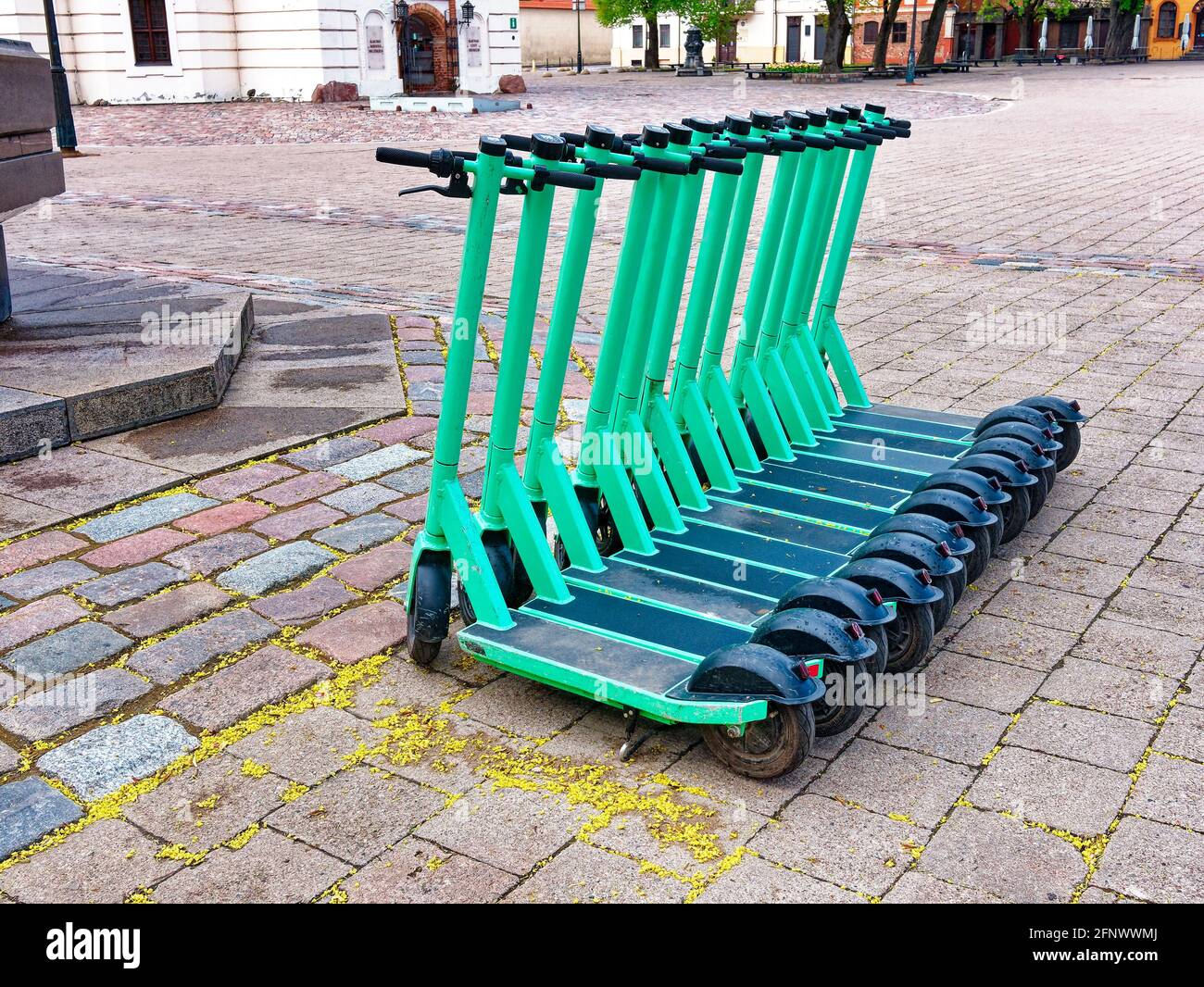 Dockless Electric Scooters on the Sidewalk. Electric scooter economical ...