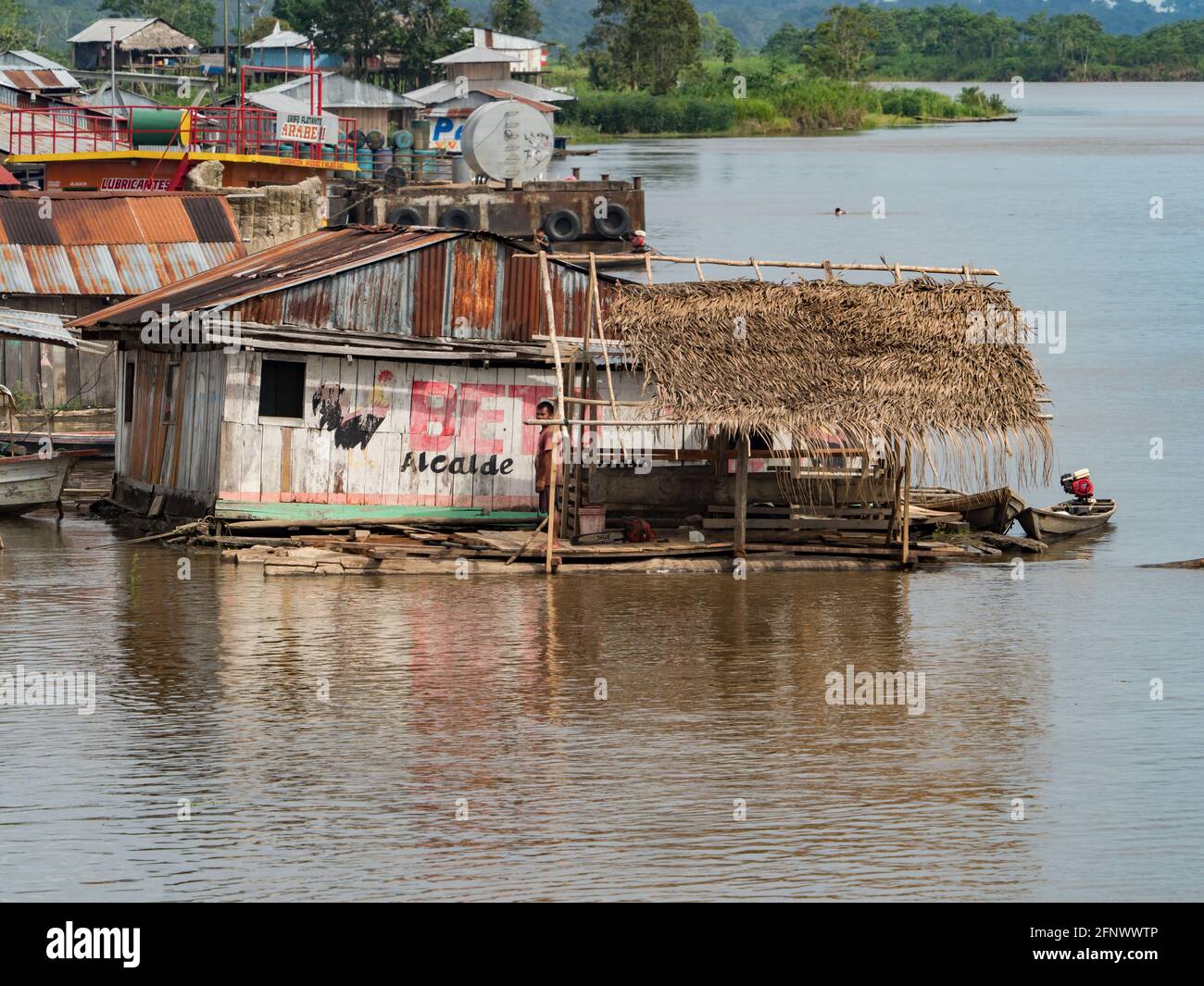 Amazon River, Peru - May 12, 2016: Small village on the bank of the ...