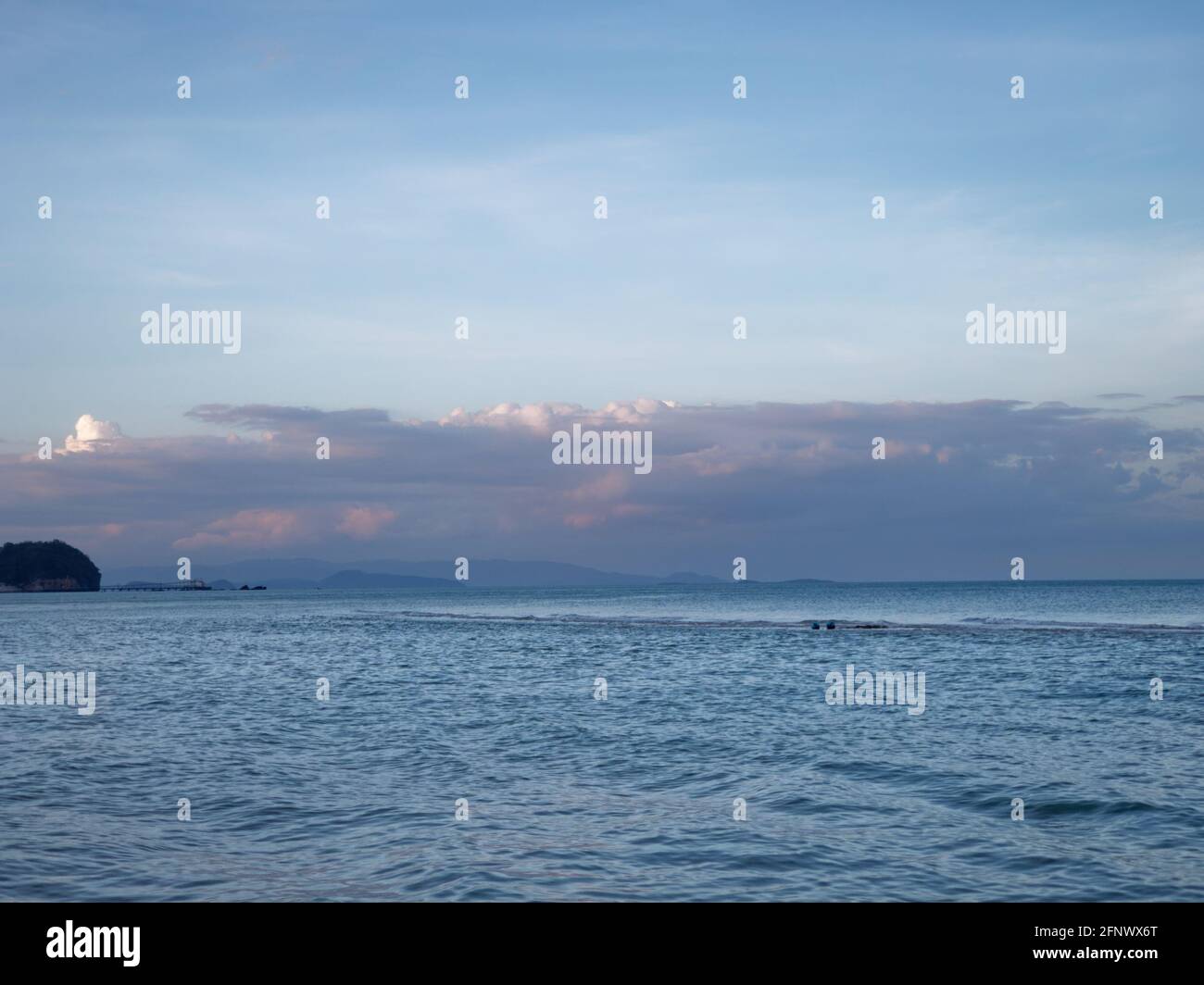Calmful ocean beach dusk with deep blue sky and breezing waves Stock ...
