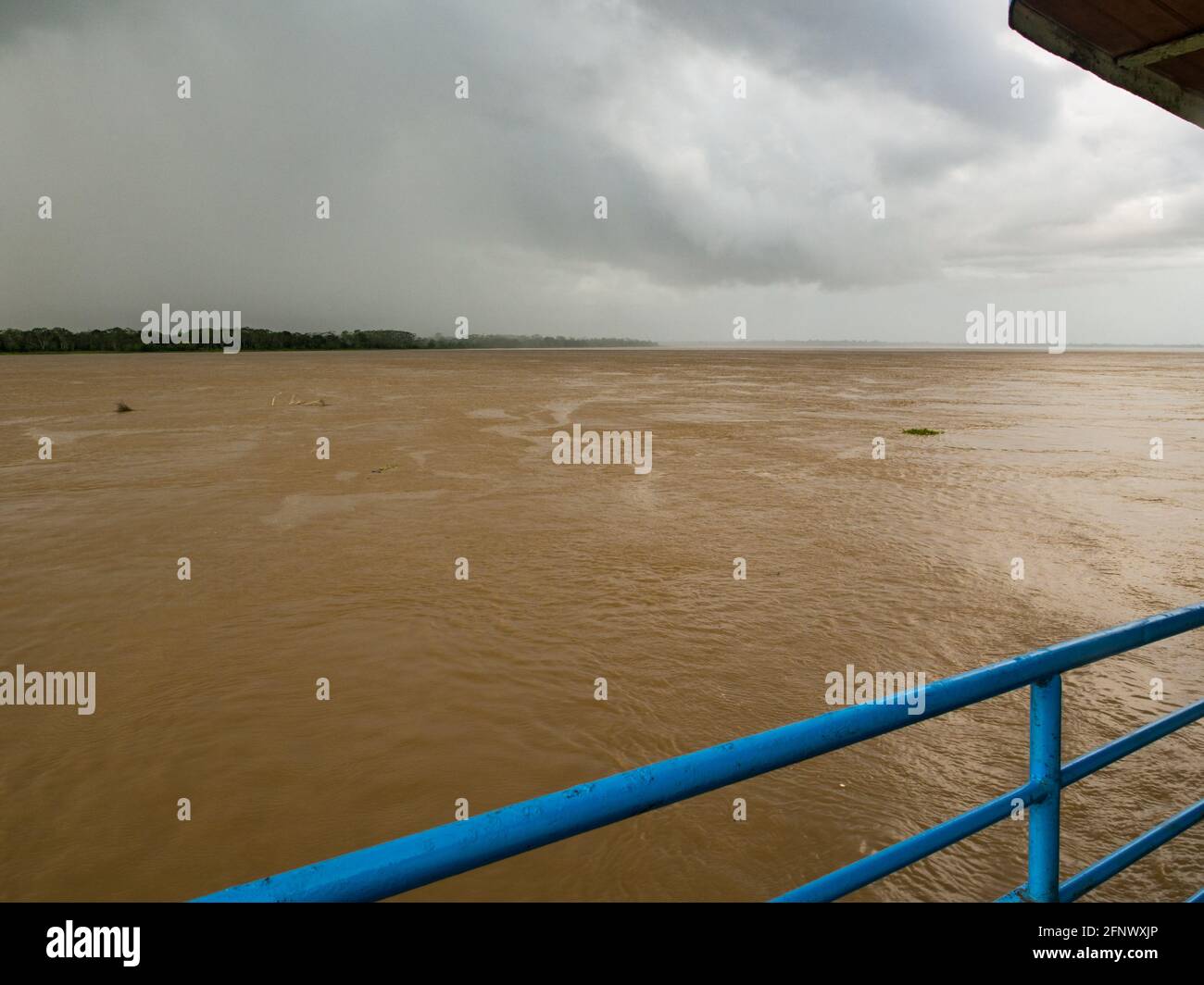 View of the Amazon River from the cargo boat during rainy day. Amazonia ...
