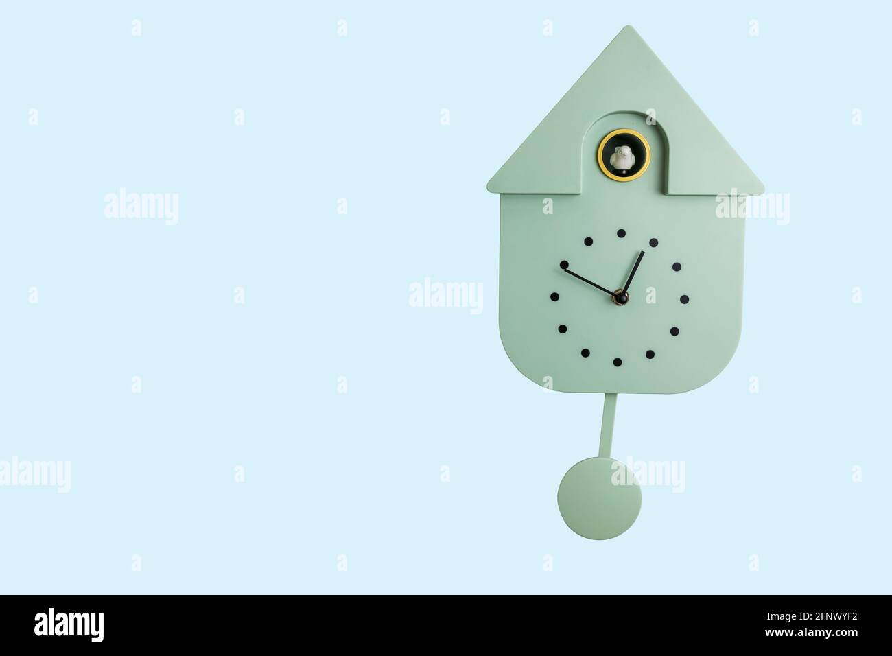 Close up view of wall cuckoo clock on blue background. Sweden Stock ...