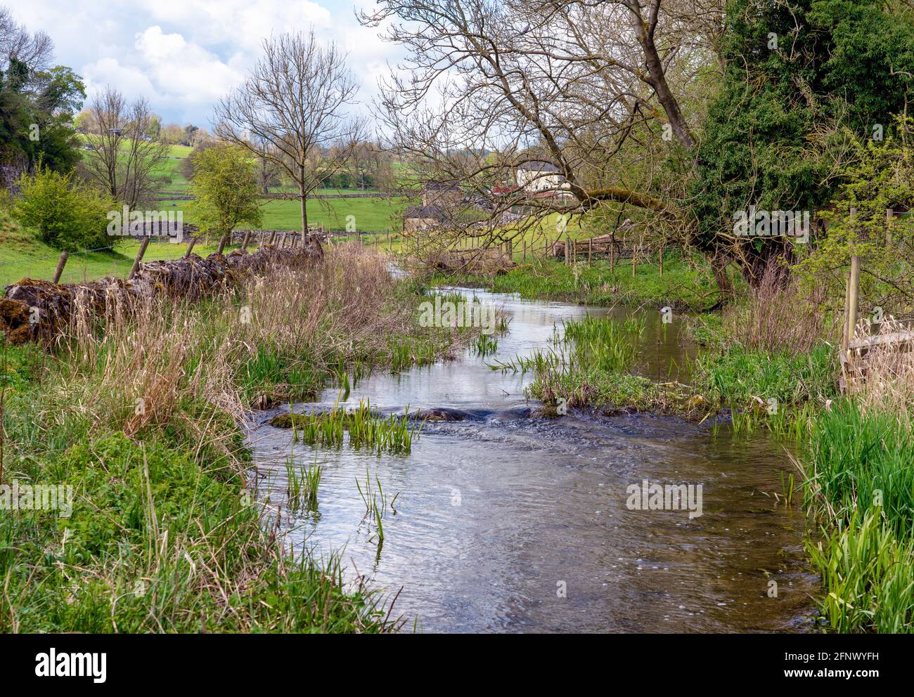 Quiet stretch of the River Bradford at Alport in the Derbyshire Peak ...