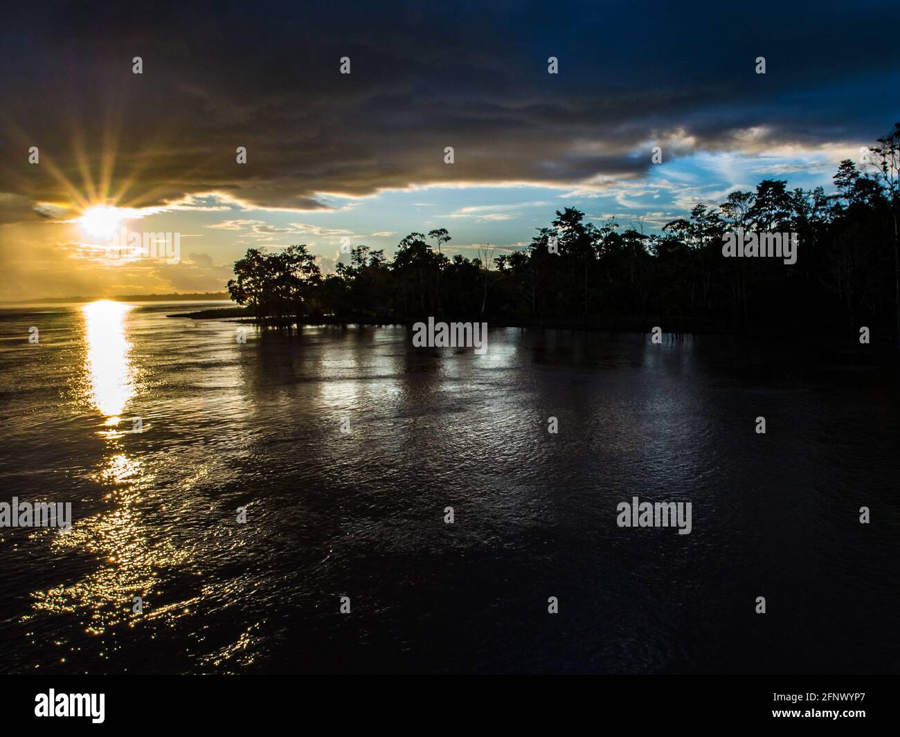 Sunset over the Amazon River, Amazonia. Peru. South America Stock Photo ...