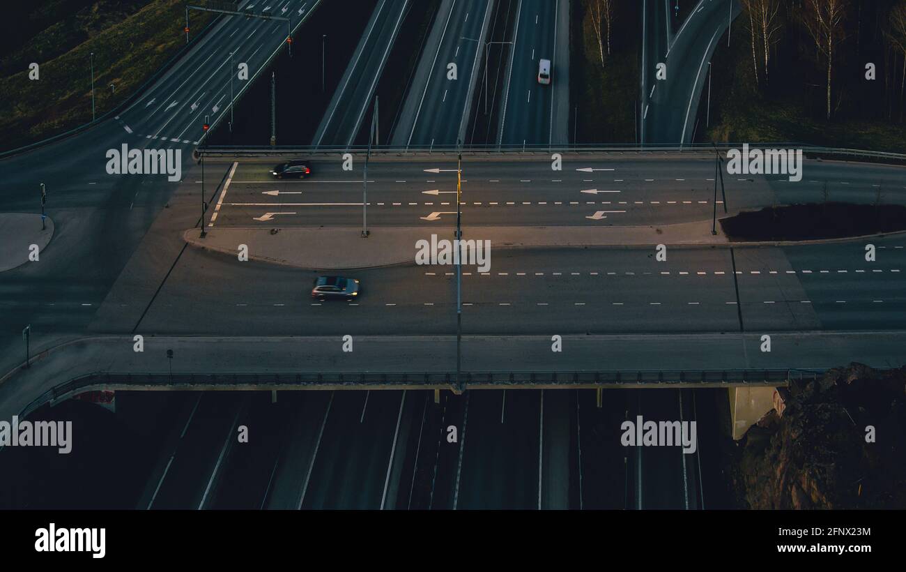 Aerial view of a junction with road markings at night Stock Photo - Alamy