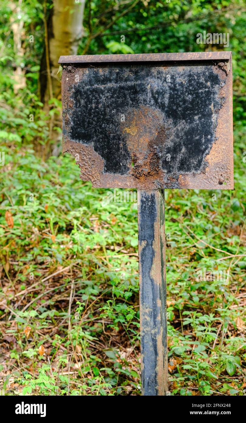 A rusted sign, originally marking the path along the Porter Valley in ...
