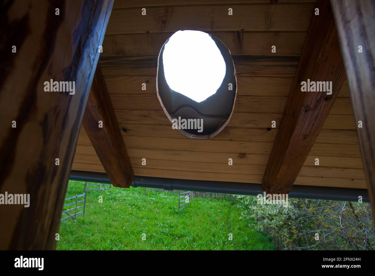 hole in the house roof. chimney ready to install Stock Photo - Alamy