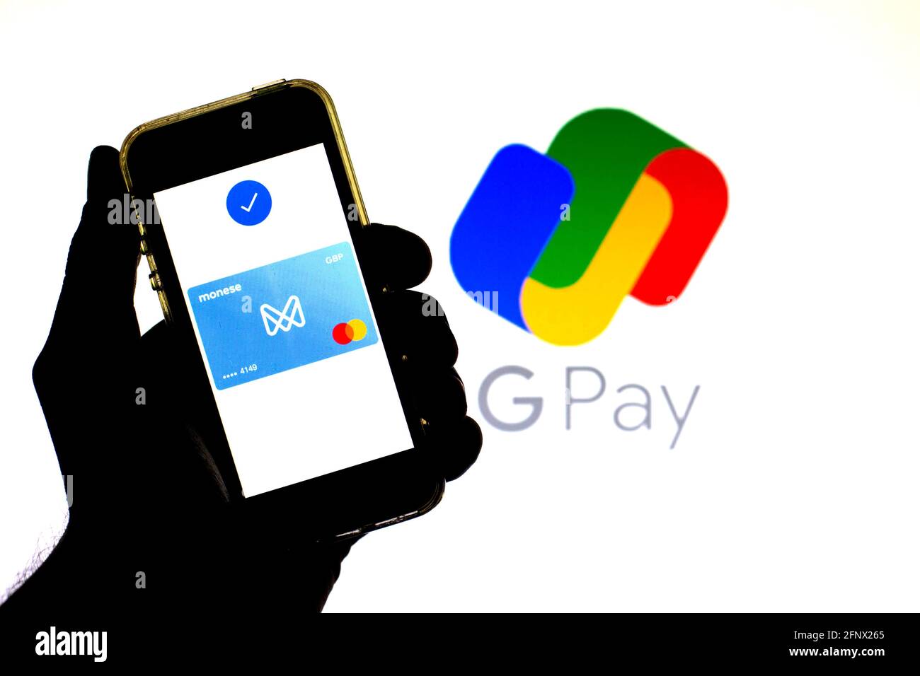 In this photo illustration a Google Pay app seen displayed on a ...